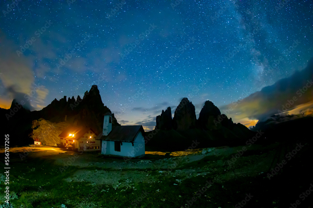 Green tent lighted from the inside against the backdrop of incredible ...