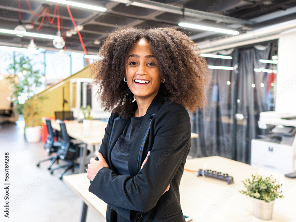 Content black female employee standing in modern workspace Stock Photo ...