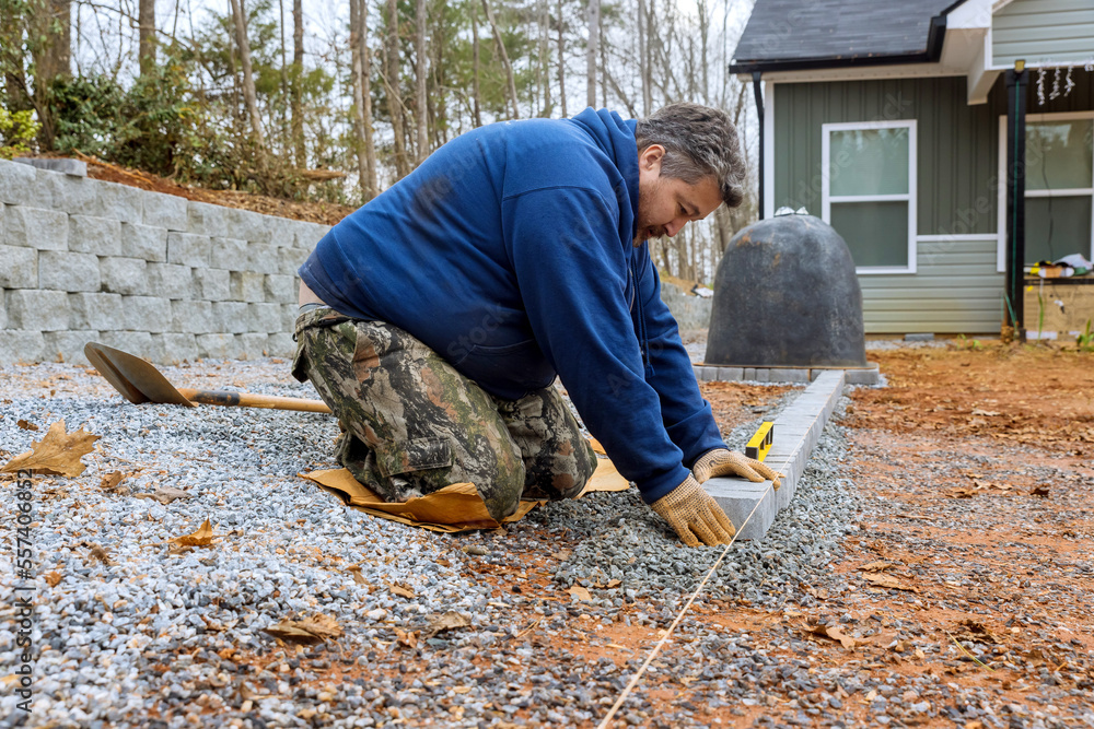 Foto de Stock Using professional paver worker master lays down stones ... Foto de Stock Using professional paver worker master lays down stones ...