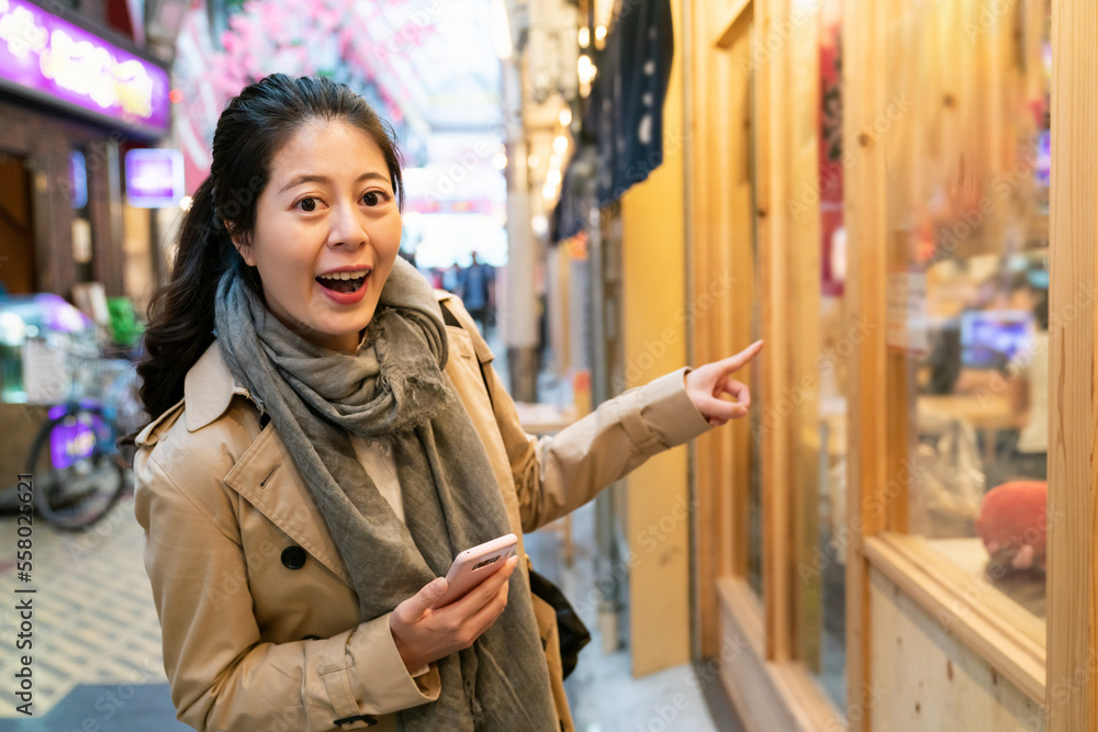 happy Asian korean female traveler looking at camera and finger ...