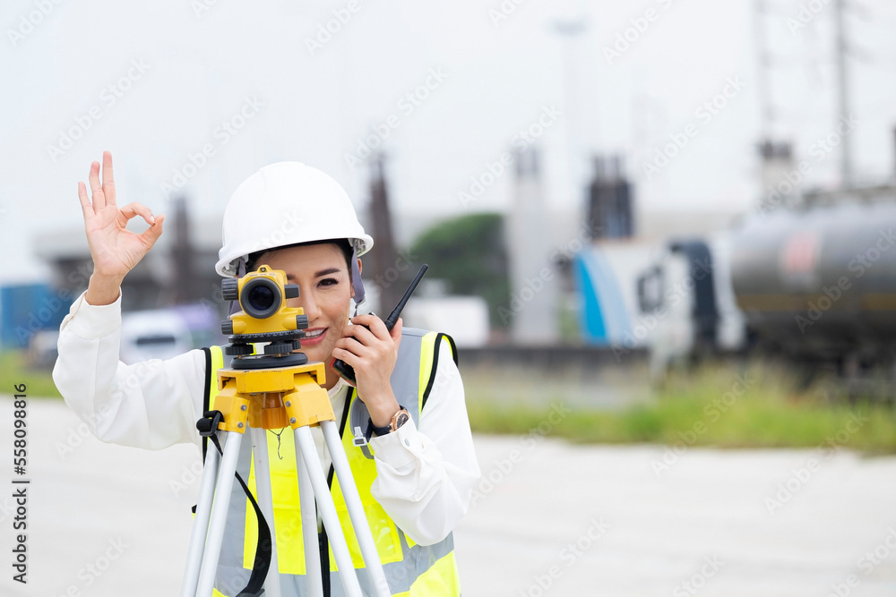 Survey equipment woman engineer. Surveyor's telescope at the ...