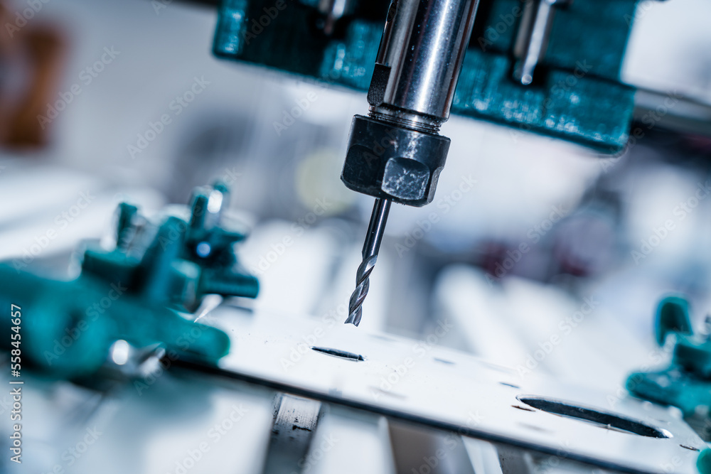 CNC milling machine cutting aluminium part. Stock Photo | Adobe Stock