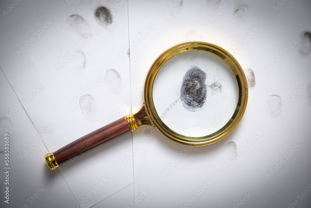 Magnifying glass and fingerprints. Detective. Investigation Stock Photo ...