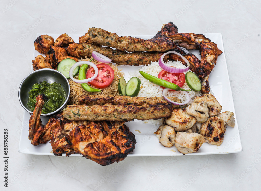 Spicy bbq chicken grill platter with chicken tikka boti kabab, reshmi ...