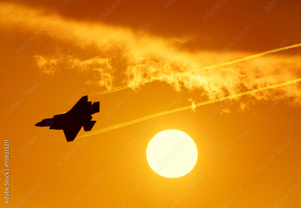 Fighter jet at sunset. Modern military fifth generation fighter jet ...