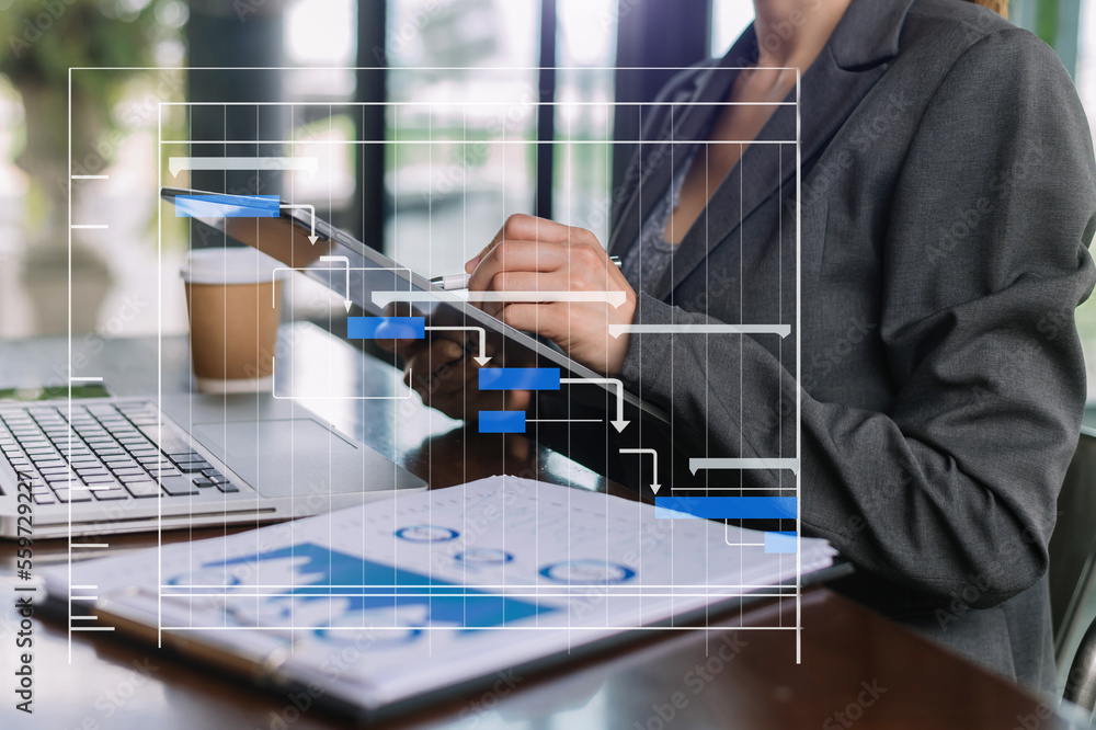 Project manager working and update tasks with milestones progress ...