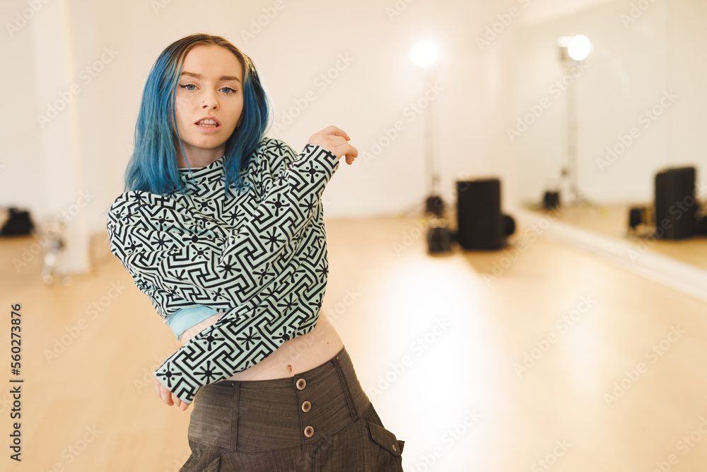 Image of caucasian female hip hop dancer posing to camera with copy ...