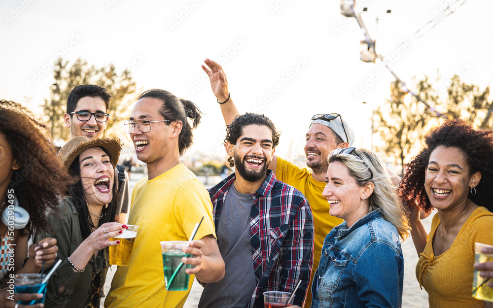 People having fun at beach party, multiracial group of generation z ...