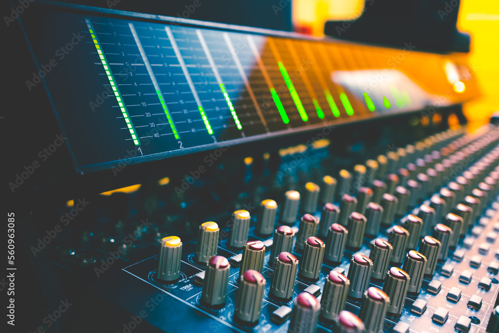 VU meter on audio mixing console meter bridge and knobs. Recording ...