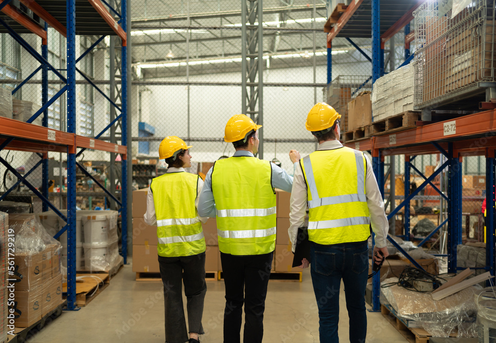 Teamwork of workers working in large warehouse retail store industry ...