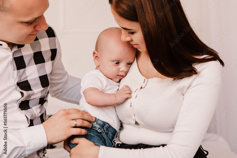 Little boy pop-eyed surprised cute child baby looking at mother breast ...
