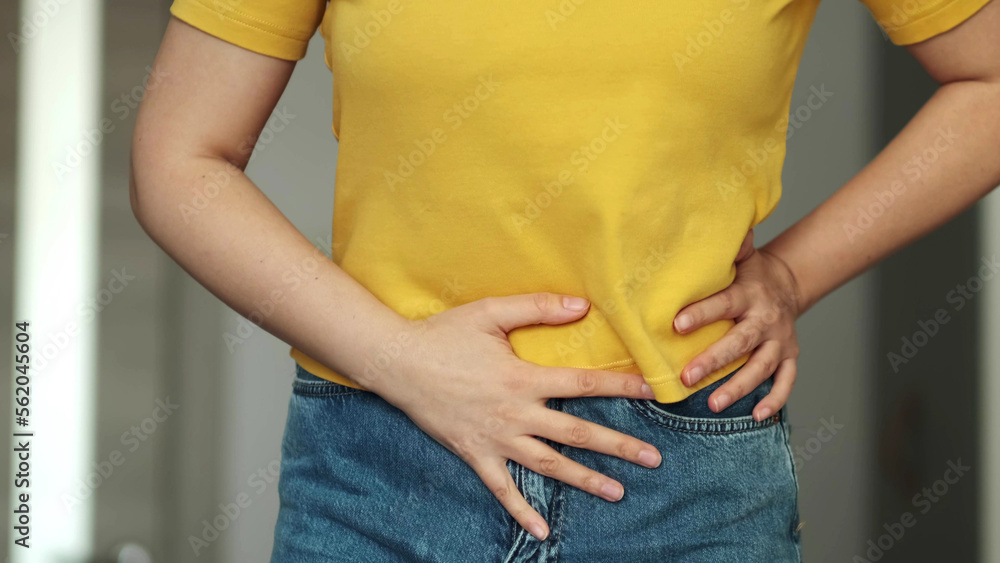 Woman touching his stomach. Stomach pain and others stomach disease ...