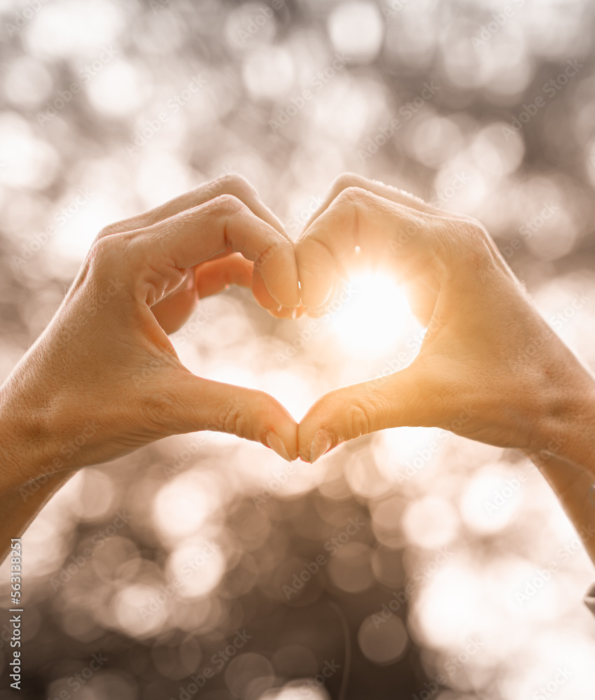 Hand making heart on sunset sky background. Love, and Valentine's Day ...