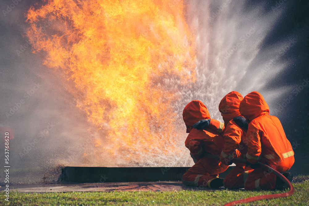 Firefighter Rescue training in fire fighting extinguisher. Firefighter ...