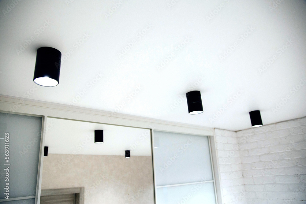 Beautiful black LED lights on the ceiling. Modern stretch ceiling ...