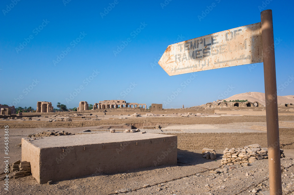 Ramesseum temple sign board pointing to the ruins of memorial temple ...