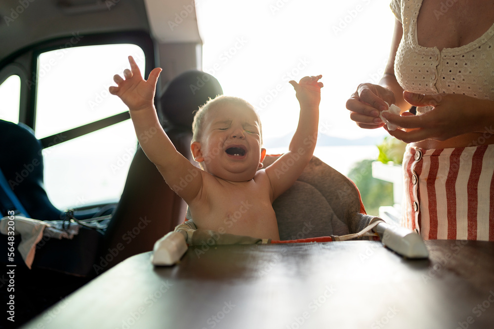 Crying and Expressive Baby in a Camper Stock Photo | Adobe Stock