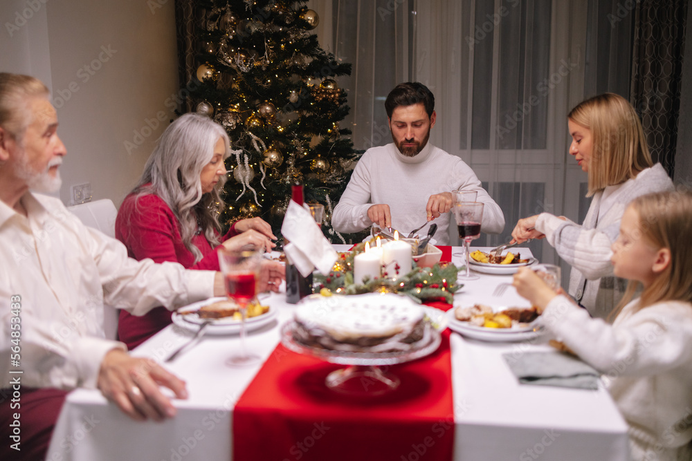 Christmas dinner party celebration eating meal family together Stock ...