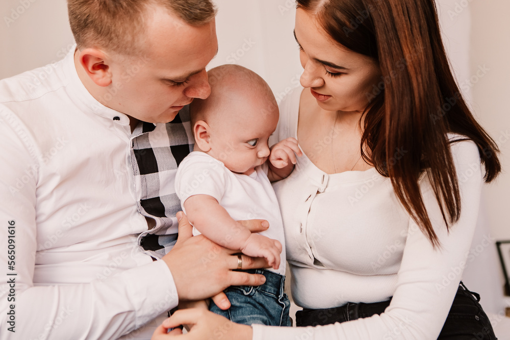 Little boy pop-eyed surprised cute child baby looking at mother breast ...