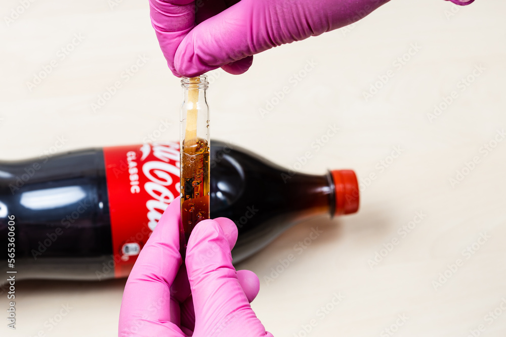 Moscow, Russia - January 12, 2023: measuring of pH level of Coca Cola ...