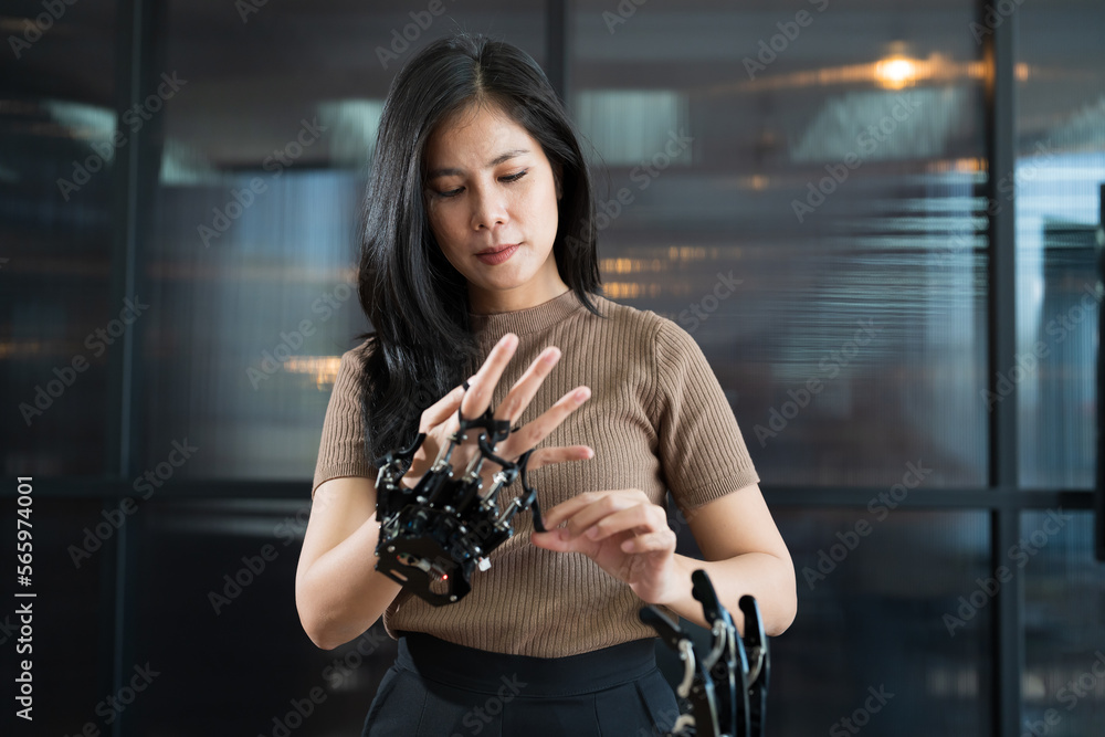 Asian female engineer working with AI robot arm system. Female engineer ...