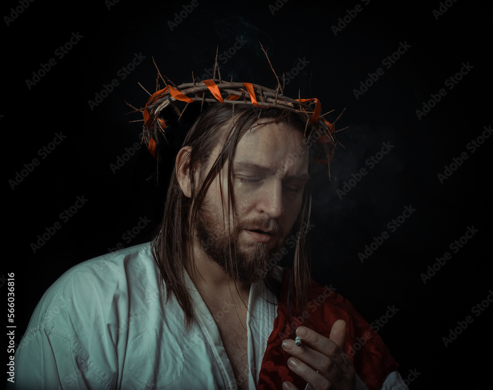 Jesus Christ smokes a cigarette wearing a crown of thorns and white ...