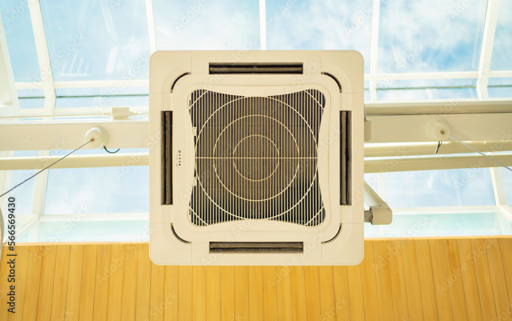 Modern white ceiling mounted cassette type air conditioner in office ...