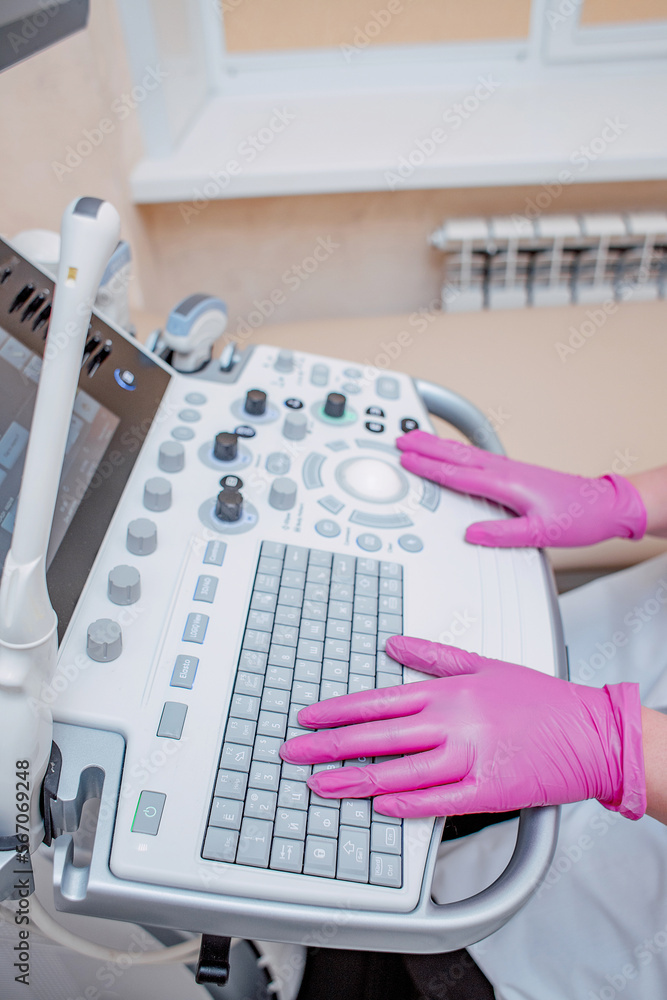 Probe for ultrasound diagnostics close-up. The doctor holds in his ...