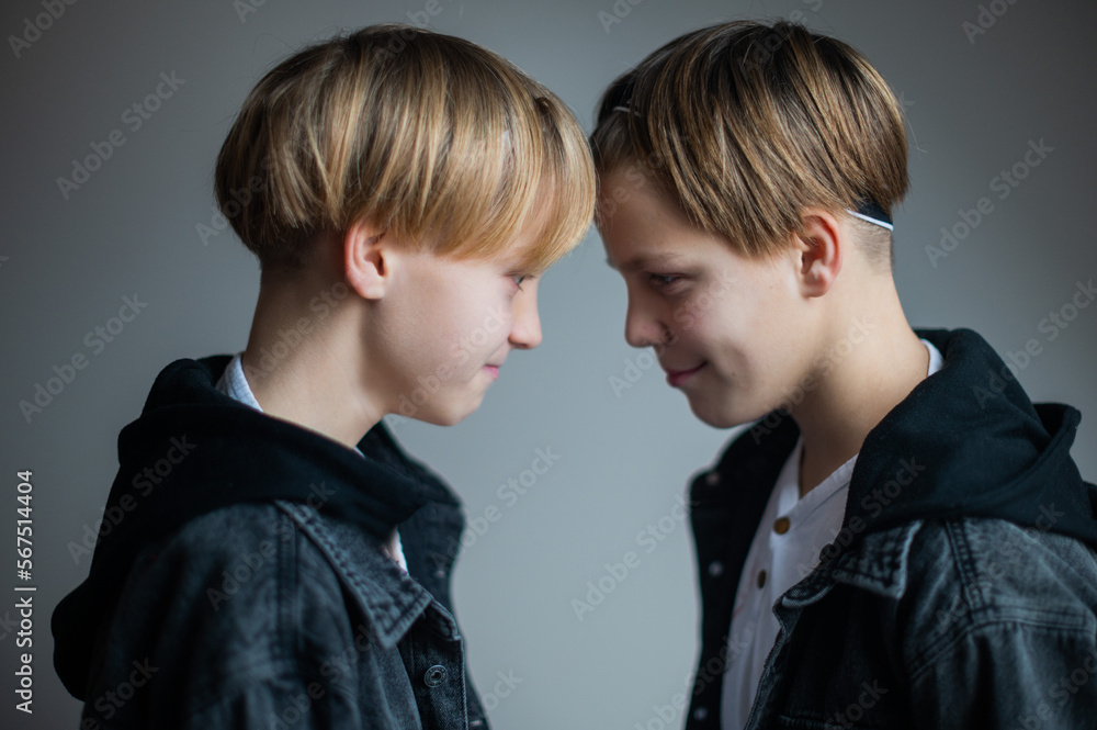 Two happy boys, happy brothers who are smiling happily together ...