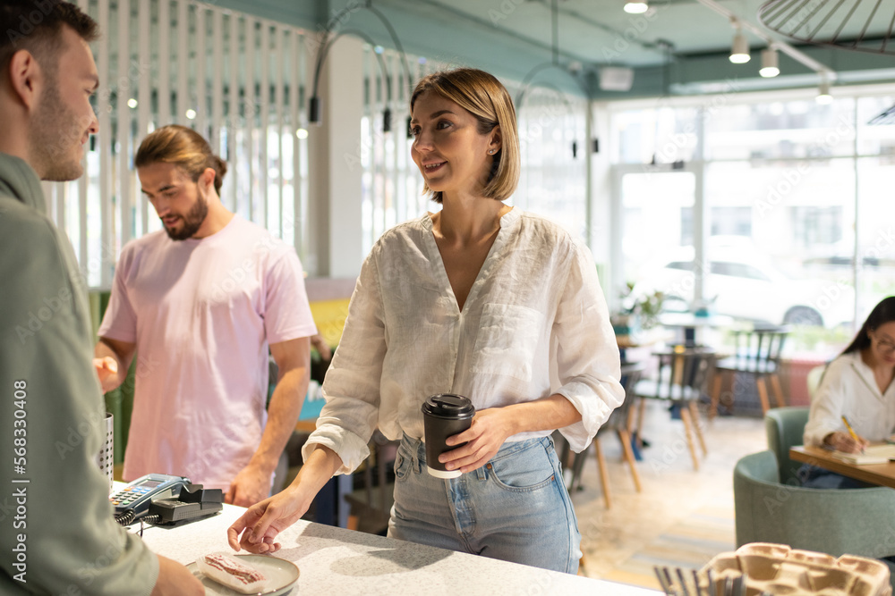 Adult woman taking order from barista Stock Photo | Adobe Stock