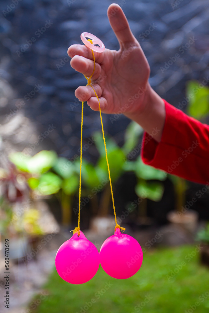 Selective focus photo of Lato-Lato, a traditional children's toy which ...