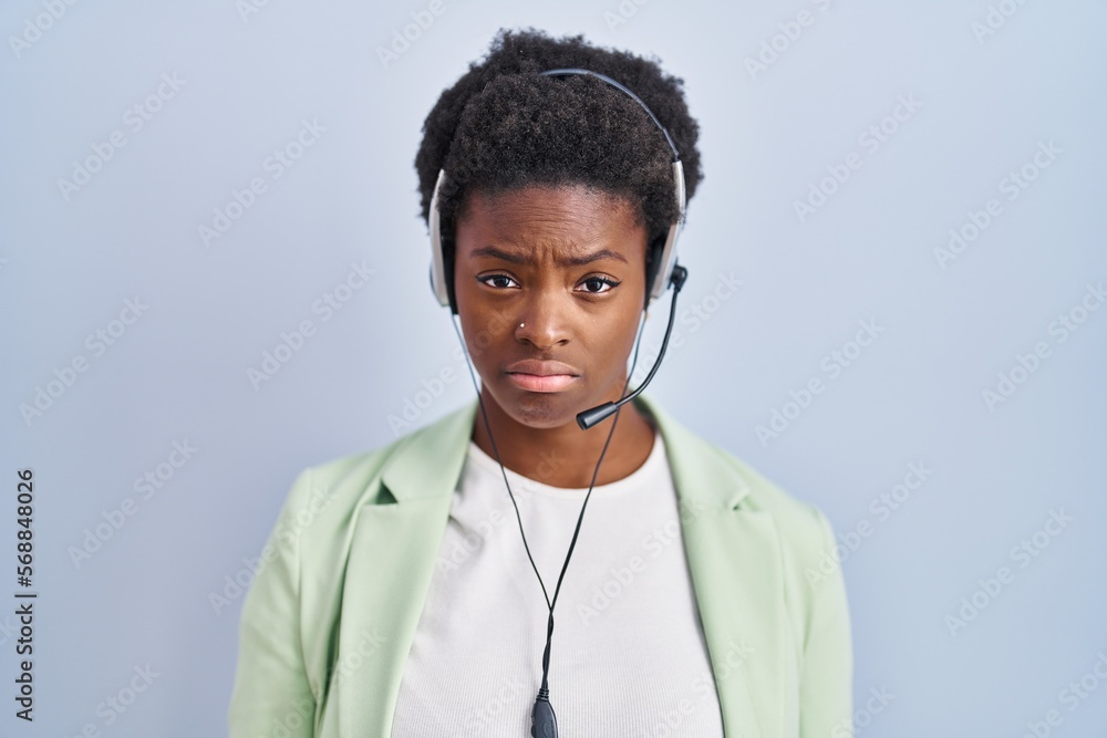 African american woman wearing call center agent headset depressed and ...