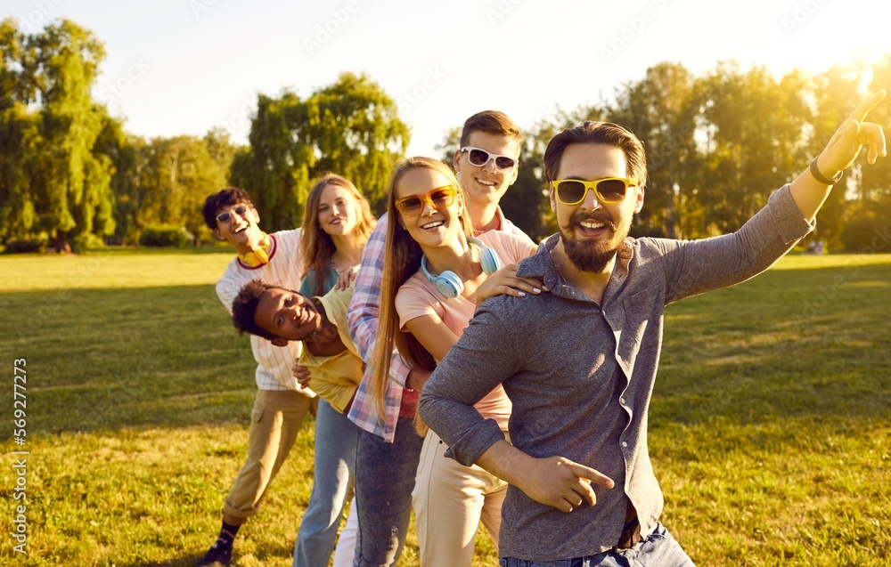 Funny and cheerful joyful company of young friends have fun together on ...