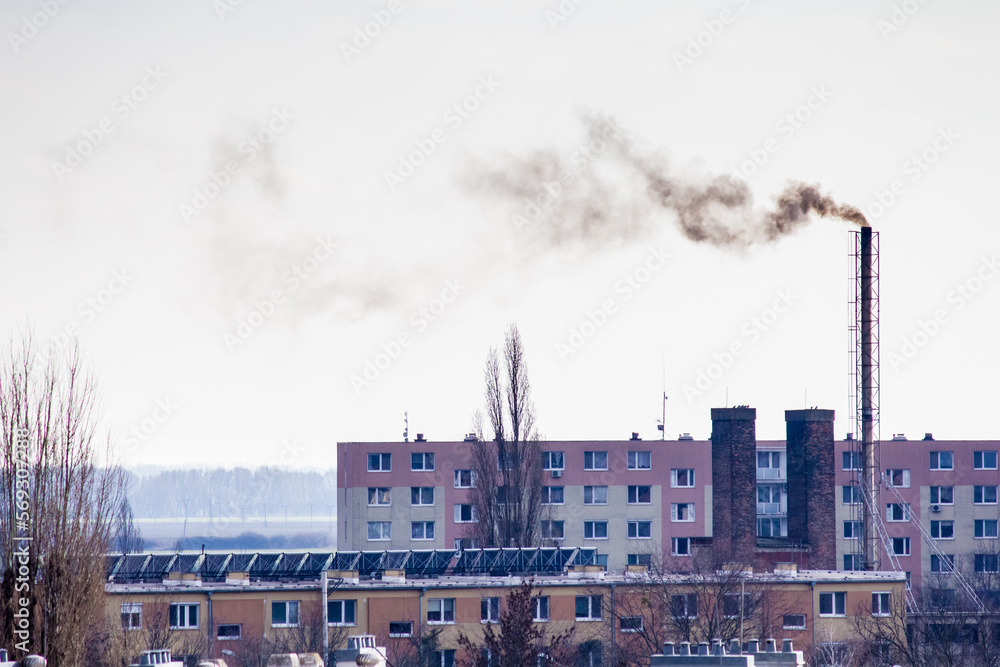 Chimneys of a solid fuel boiler house in the center of a European city ...