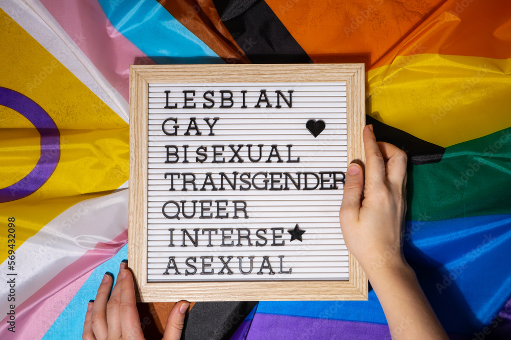 LGBTQIA description frame on Rainbow LGBTQIA flag made from silk ...