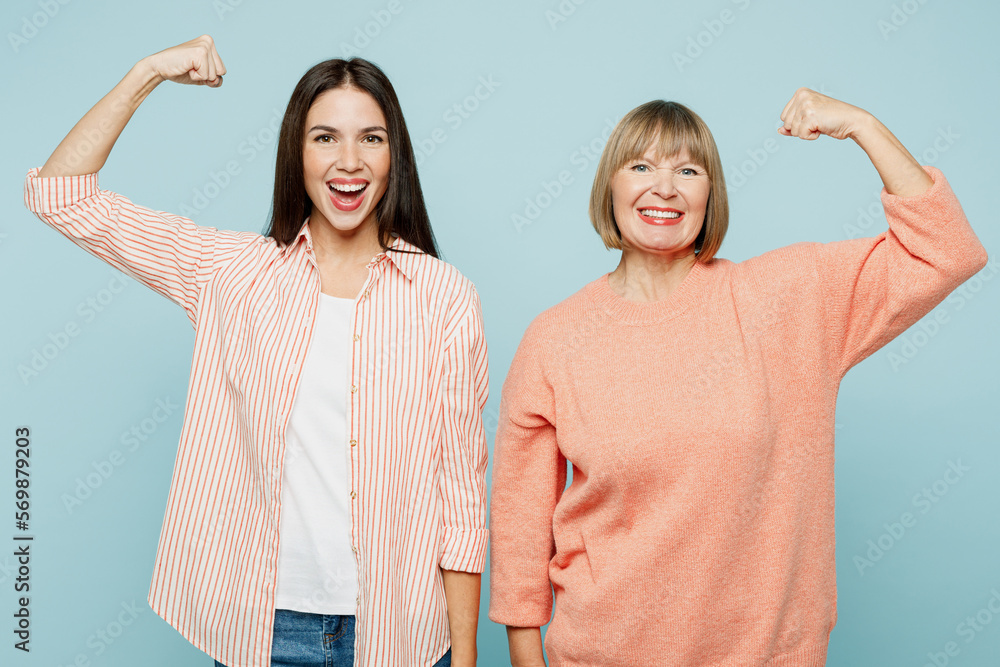Elder parent mom with young adult daughter two women together in casual ...