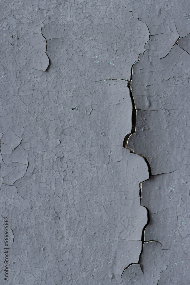 Peeling paint on the wall. Old concrete wall with cracked flaking paint. Weathered rough painted ...