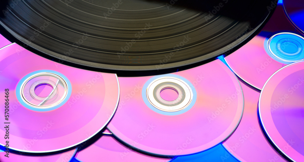 beautiful background with a vinyl record and CDs. music entertainment ...