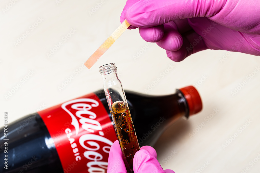 Moscow, Russia - January 12, 2023: measuring of pH level of Coca Cola ...