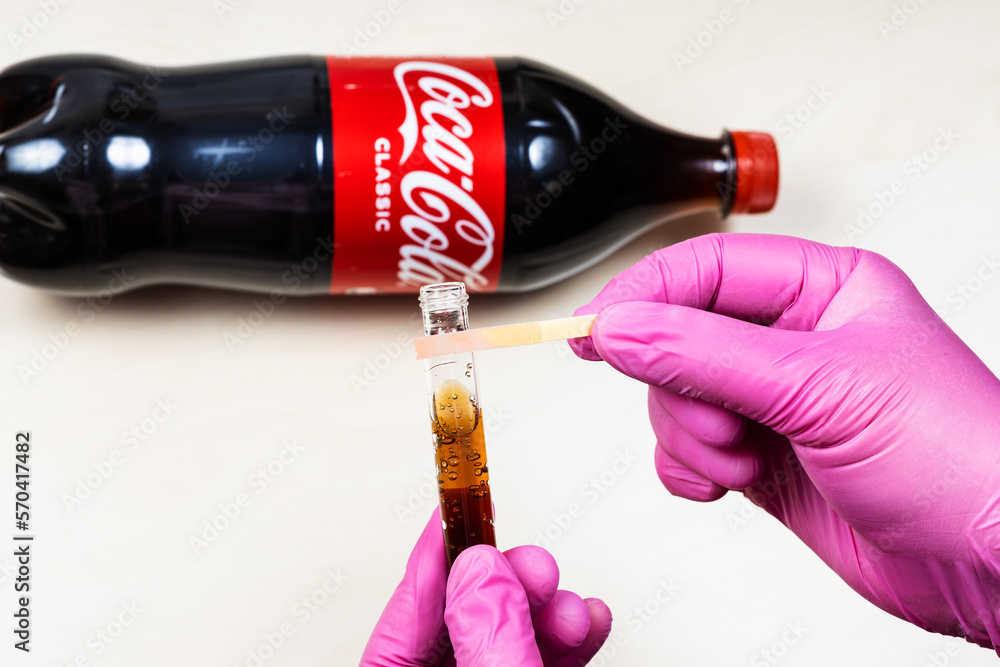 Moscow, Russia - January 12, 2023: measurement of acidity level of Coca ...