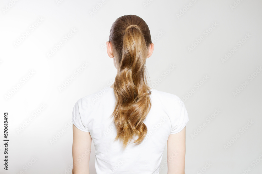 Closeup curly wavy imperfect pony tail back view isolated on white ...