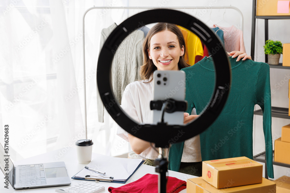 Beautiful woman describe selling clothes on camera live broadcast on ...