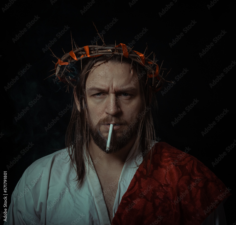 Jesus Christ smokes a cigarette wearing a crown of thorns and white ...