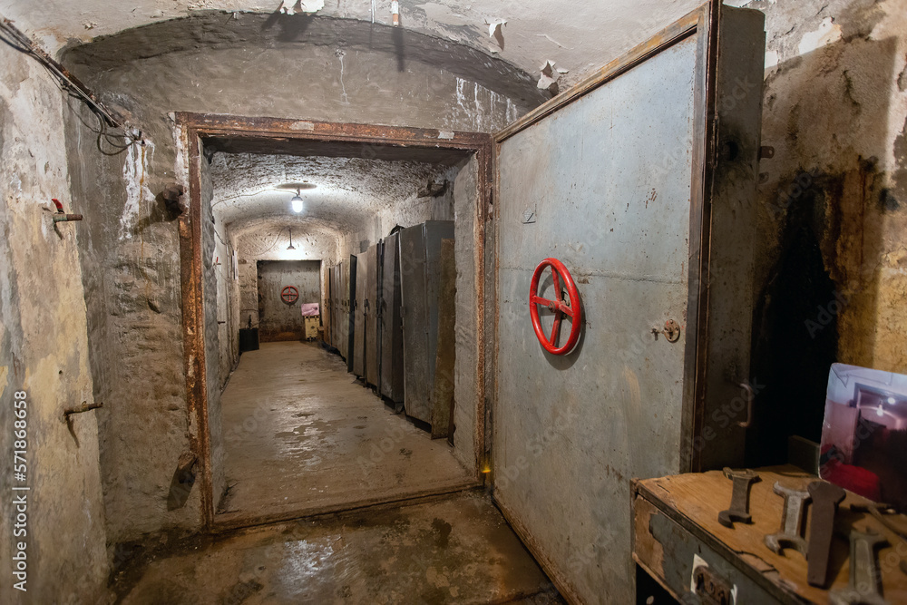 Hermetic rusty door of the bunker in underground abandoned tunnel ...