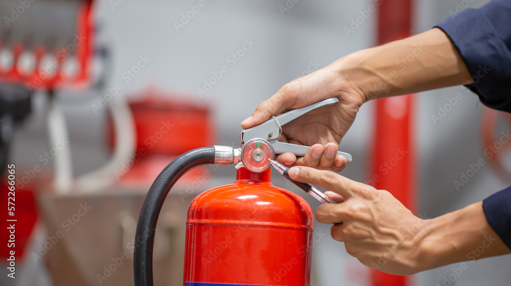 Engineer are checking and inspection a fire extinguishers tank in the ...