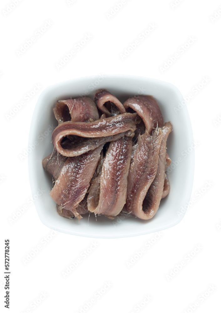 SARDELLE, ANCHOVIES Anchovy fillet in small white ceramic dish isolated ...