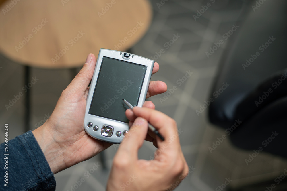 Old school PDA device with stylus from early 2000s and millennium Stock ...