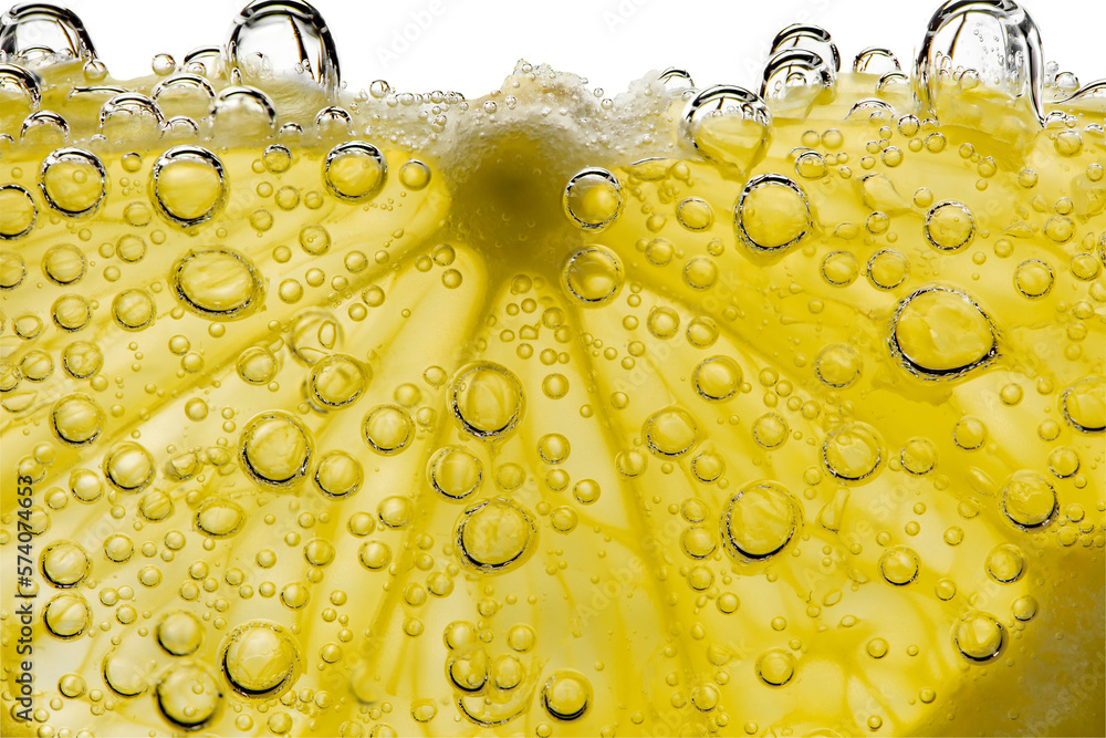 Lemon yellow sliced in water with air bubbles, in background light ...