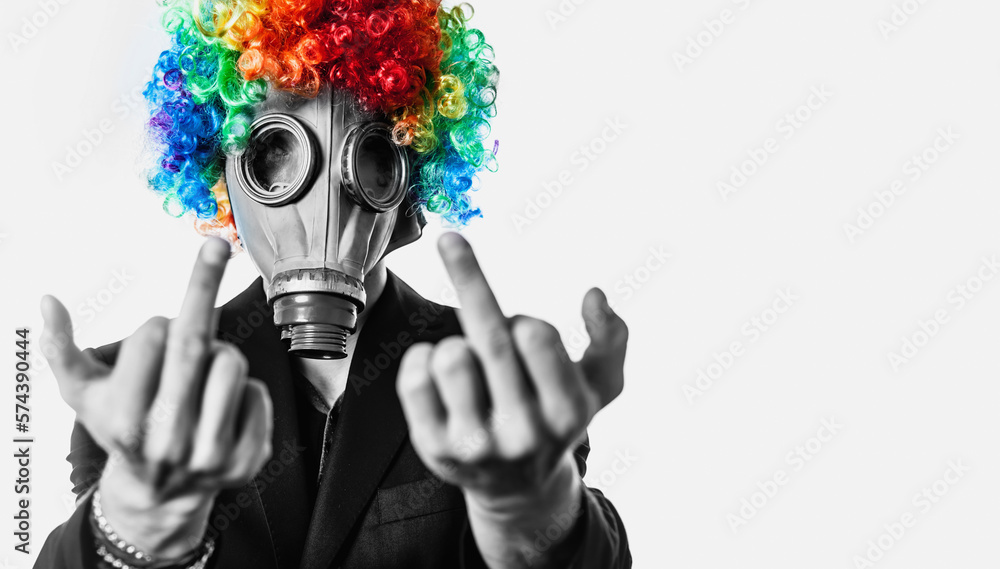 Office employee clown in suit in the gas mask showing middle finger ...