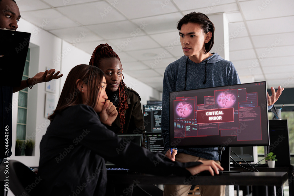Diverse group of software developers having hacked server and security ...